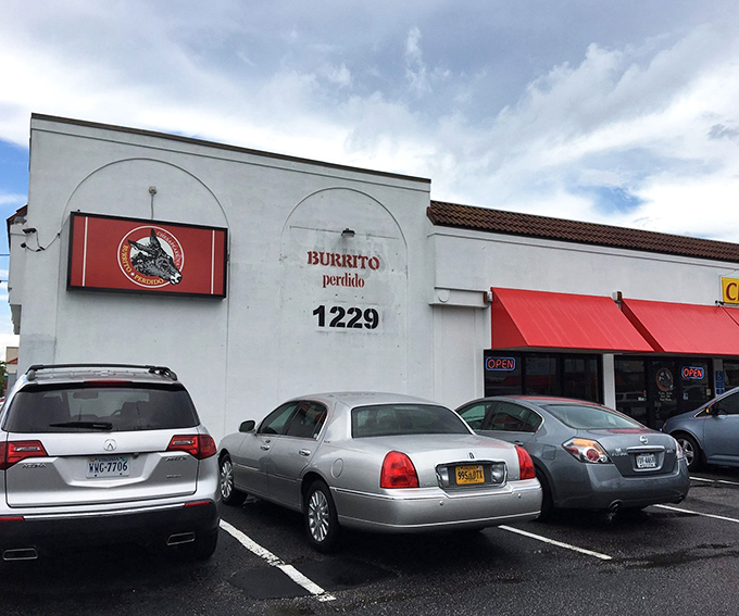 The unassuming storefront that launched a thousand road trips. Like finding a diamond in a strip mall, Burrito Perdido's exterior promises culinary treasures within.