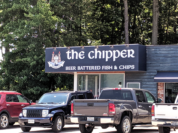 The blue wooden exterior of The Chipper stands like a portal to Britain, promising authentic beer-battered treasures within its unassuming walls.