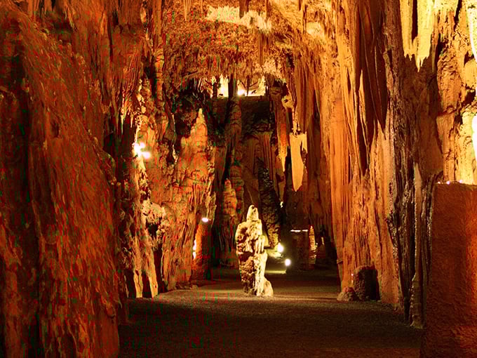 Nature's own cathedral of stone, where amber-hued formations create an otherworldly landscape that's been mesmerizing visitors for centuries.