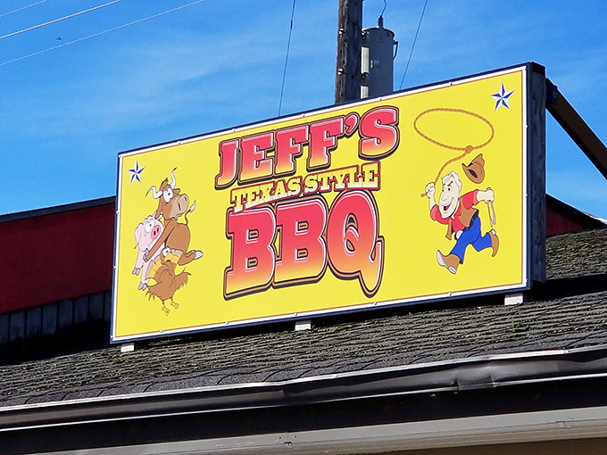 The bright yellow sign of Jeff's Texas Style BBQ beckons hungry travelers like a smoky lighthouse guiding ships through fog.