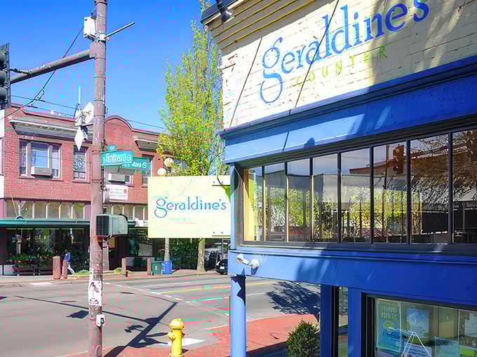 The cheerful blue exterior of Geraldine's Counter brightens up Columbia City's streetscape like a culinary lighthouse guiding hungry travelers home.