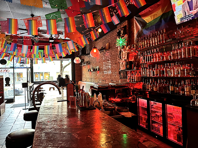 The vibrant triangular sign beckons like a neon North Star for hungry wanderers. Colorful string lights add a festive touch to Broadway's bustling scene.
