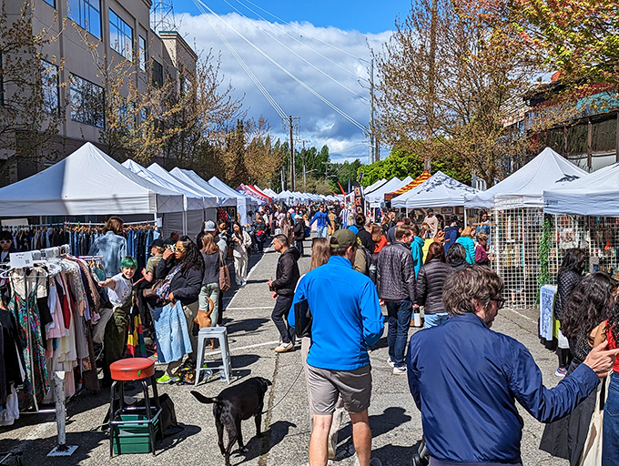 Colorful banners reach skyward, welcoming weekend treasure hunters to Seattle's ultimate urban safari. The hunt begins!