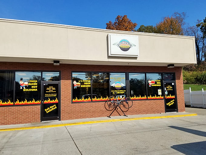The unassuming storefront with its flame-decorated windows is like a beacon to barbecue pilgrims. Smoke signals that say "come hungry, leave happy."