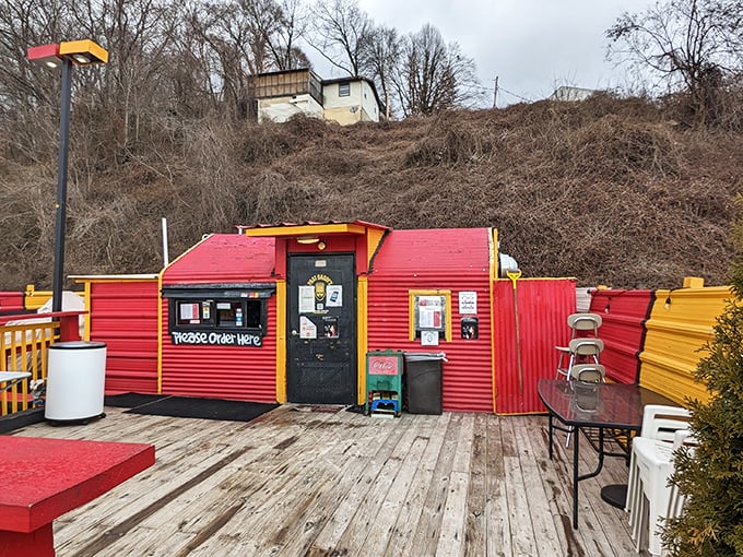 The vibrant red exterior of Phat Daddy's on Da Tracks stands out like a culinary beacon, promising flavor adventures from its humble Charleston hillside perch.