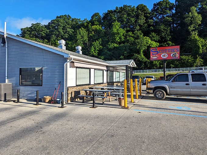Simplicity speaks volumes at Scottie's exterior, where that iconic red sign promises hamburger heaven against West Virginia's rolling hills.