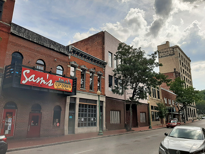 The iconic red sign of Sam's Uptown beckons like a culinary lighthouse on Washington Street, promising good times and even better food in downtown Charleston.