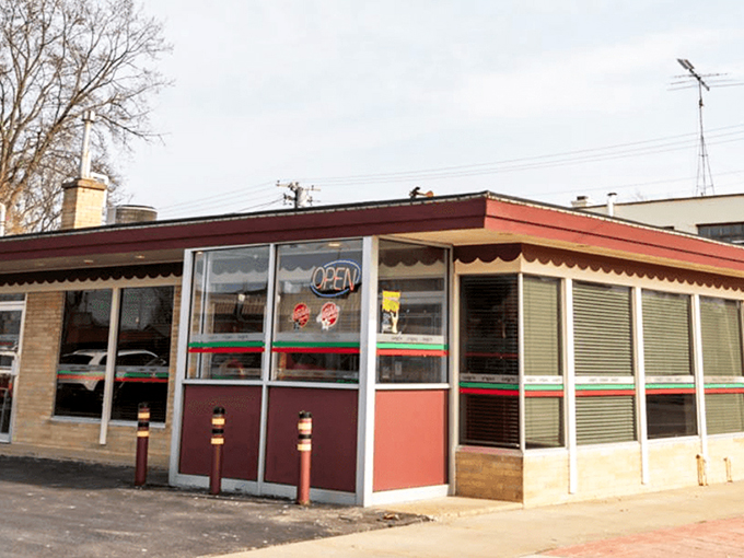 The classic red and green striped awning of Luigi's Pizza Kitchen stands as Kenosha's beacon for carb enthusiasts seeking Italian-American nirvana.