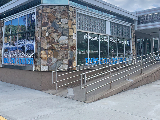 The stone facade and iconic blue signage of the "World Famous" Roscoe Diner stands as a beacon for hungry travelers along Route 17, promising comfort food salvation ahead.