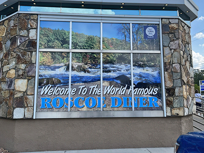 The stone facade and iconic blue signage of the "World Famous" Roscoe Diner stands as a beacon for hungry travelers along Route 17, promising comfort food salvation ahead.