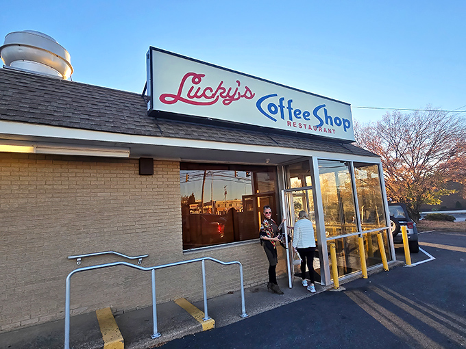 That iconic pink and blue sign beckons like a neon promise of comfort food nirvana. Lucky indeed are those who step inside.