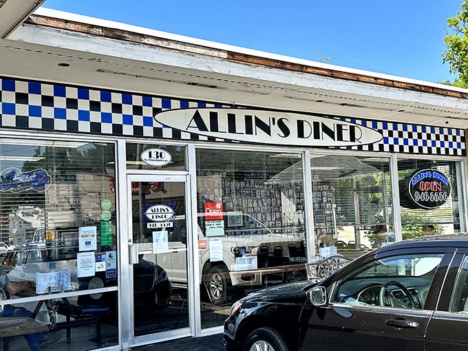 The classic black-and-white checkered awning of Allin's Diner isn't just decoration&mdash;it's a beacon calling hungry souls to pancake paradise.