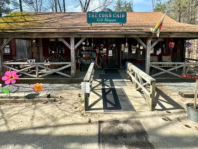 The Corn Crib gift shop welcomes you with rustic charm and colorful flower decorations. Your maple syrup journey begins before you even reach the pancakes!