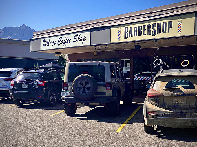 The iconic Village Coffee Shop sign stands proudly against the Colorado blue sky, promising breakfast salvation to hungry Boulder residents.