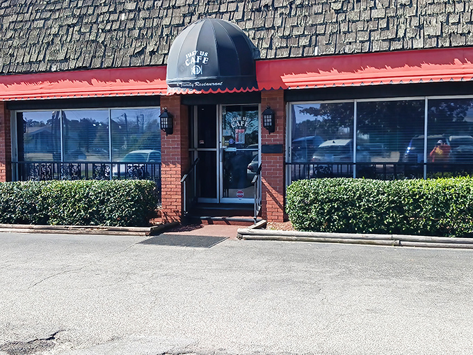 The blue awning beckons like an old friend, promising comfort food treasures behind that brick facade. Small-town breakfast magic awaits.