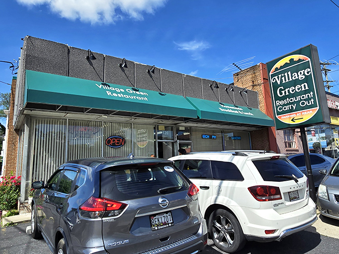 The iconic green awning of Village Green Restaurant stands as a beacon of breakfast hope in Gaithersburg. No frills, just promises of good food within.