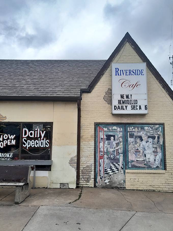 The unassuming A-frame exterior of Riverside Cafe stands like a time capsule, complete with a hand-painted mural promising culinary treasures within.