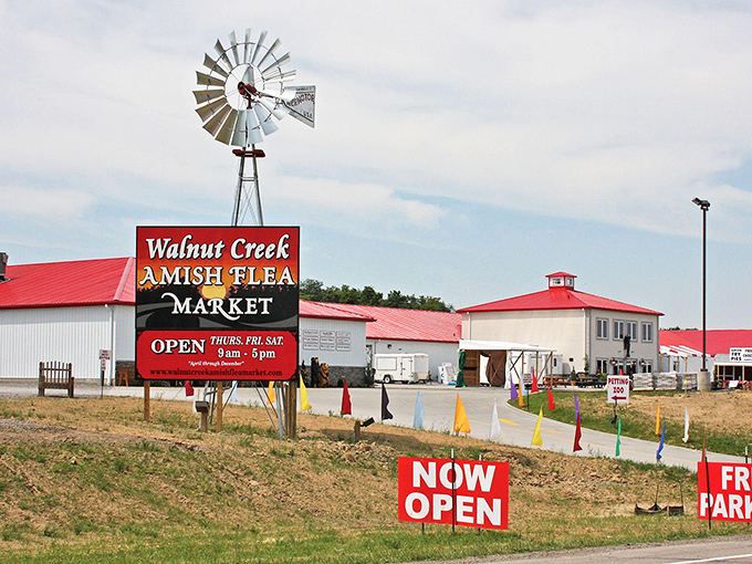 The iconic windmill and red-roofed buildings of Walnut Creek Marketplace stand as a beacon for treasure hunters in Ohio's Amish Country.
