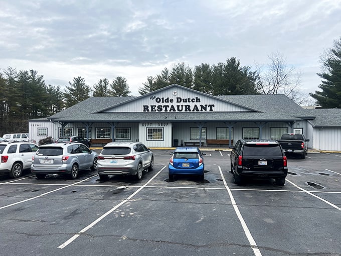 The unassuming white exterior of Olde Dutch Restaurant beckons like an old friend, promising comfort food treasures within its humble walls.