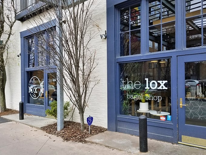 The sleek exterior of The Lox Bagel Shop beckons like a modern-day siren song for carb enthusiasts. That metal awning? Pure architectural foreplay.
