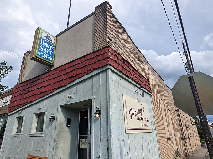 The unassuming exterior of Henry's Salt of the Sea stands like a culinary speakeasy, hiding treasures that locals have sworn by for decades.