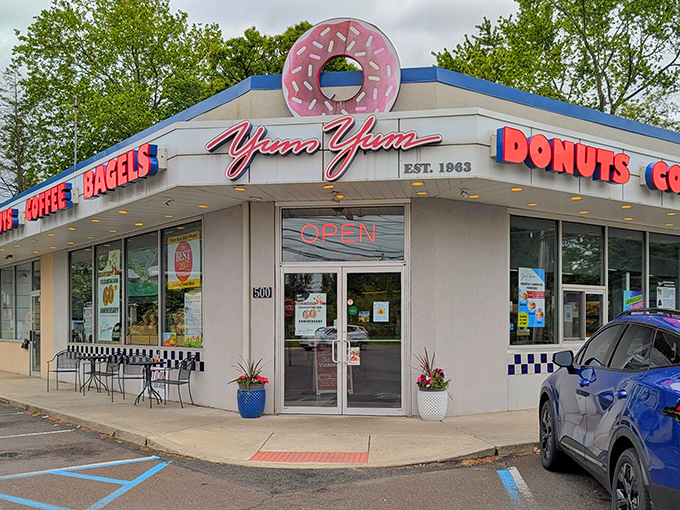 The giant pink donut beckons like a sugary lighthouse. Yum Yum's unassuming corner shop in Warminster has been stopping traffic since the Beatles were topping charts.
