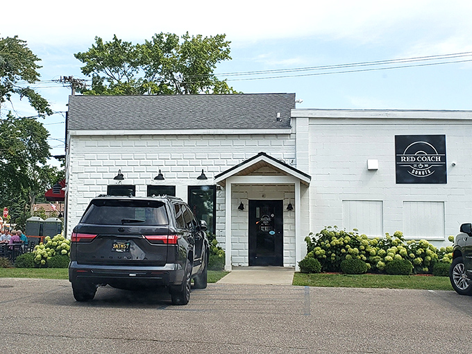 The unassuming white brick exterior of Red Coach Donuts in Stevensville hides a treasure trove of sugary delights waiting inside.