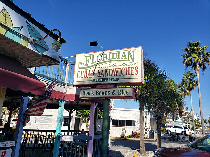 The Florida sunshine seems to shine a little brighter on this mint-green and burgundy sandwich haven, where "CUBANS" isn't just signage&mdash;it's a promise.