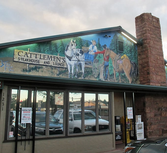 The iconic Cattlemen's sign stands tall against the Arizona sky, beckoning hungry travelers like a beef-scented lighthouse in the White Mountains.