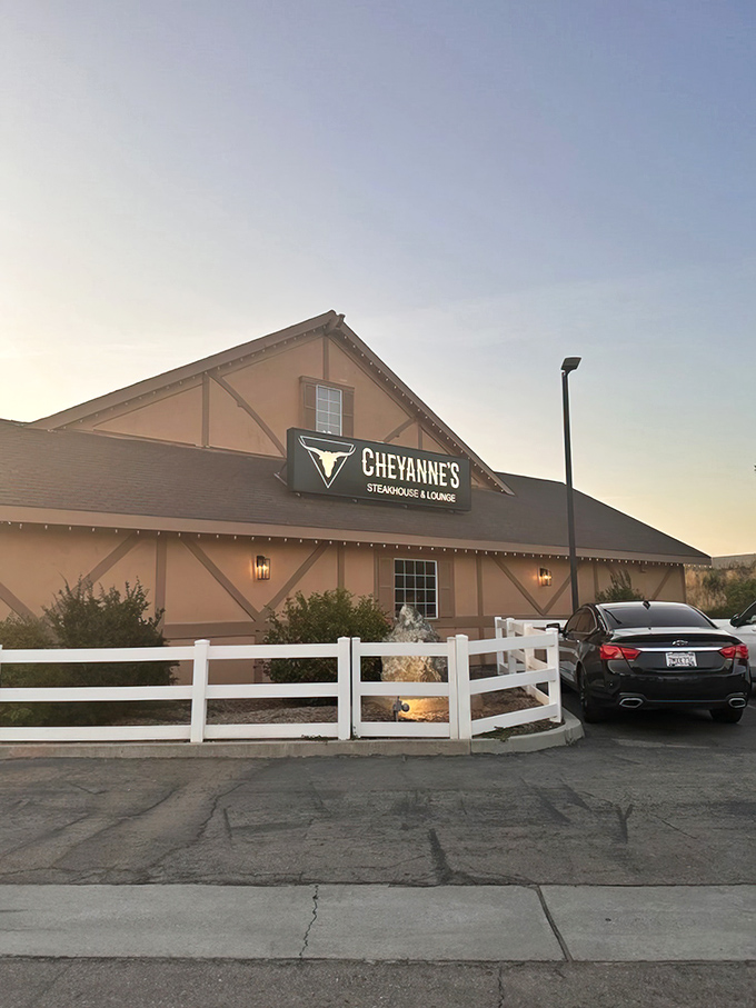 The barn-like exterior of Cheyanne's glows with inviting warmth against the night sky, like a beacon for hungry travelers on California's Highway 99.