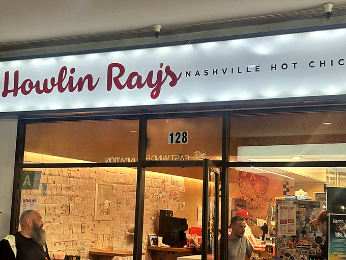 The fiery entrance to Howlin' Ray's beckons brave souls with its flame-adorned doors. This isn't just dinner&mdash;it's a delicious dare.
