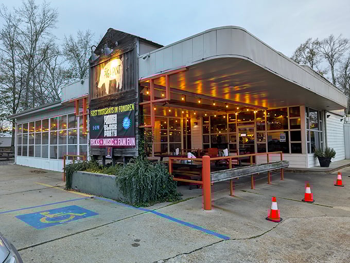 The iconic pig silhouette welcomes barbecue pilgrims to this Fondren district gem, where string lights promise good times ahead.