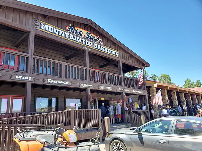 The wooden facade of Mad Jack's stands like a barbecue beacon in the mountains, promising smoky treasures within those rustic walls.