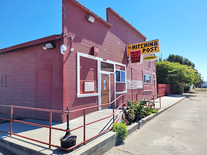 The red exterior of The Hitching Post stands like a culinary lighthouse in Casmalia, beckoning hungry travelers with promises of smoky perfection.