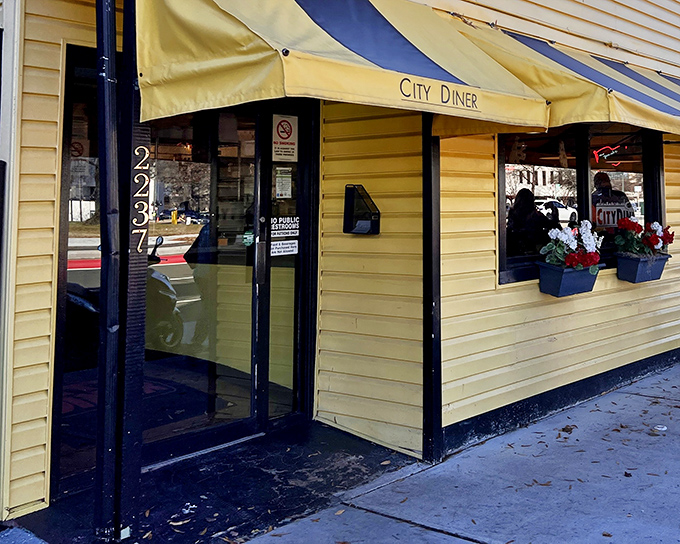 The cheerful yellow exterior of City Diner stands like a beacon of breakfast hope on Richmond's Cary Street.