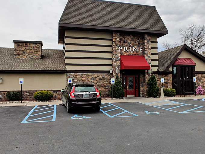 The stone-and-timber exterior of Prime Steak House stands like a carnivore's cathedral, its red awning beckoning hungry pilgrims from across Pennsylvania.
