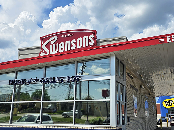 The iconic red and white Swensons facade stands proudly against an Ohio sky, promising burger bliss to all who flash their headlights.