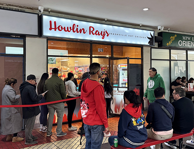 The fiery entrance to Howlin' Ray's beckons brave souls with its flame-adorned doors. This isn't just dinner&mdash;it's a delicious dare.