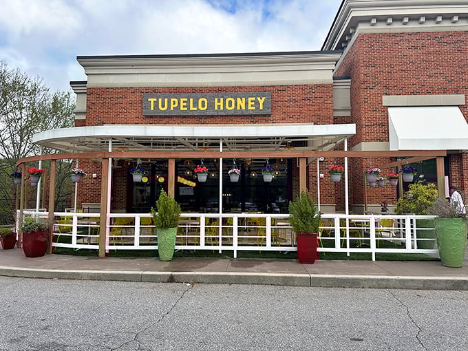 The brick exterior with its cheerful yellow signage feels like a warm Southern invitation you simply can't refuse.