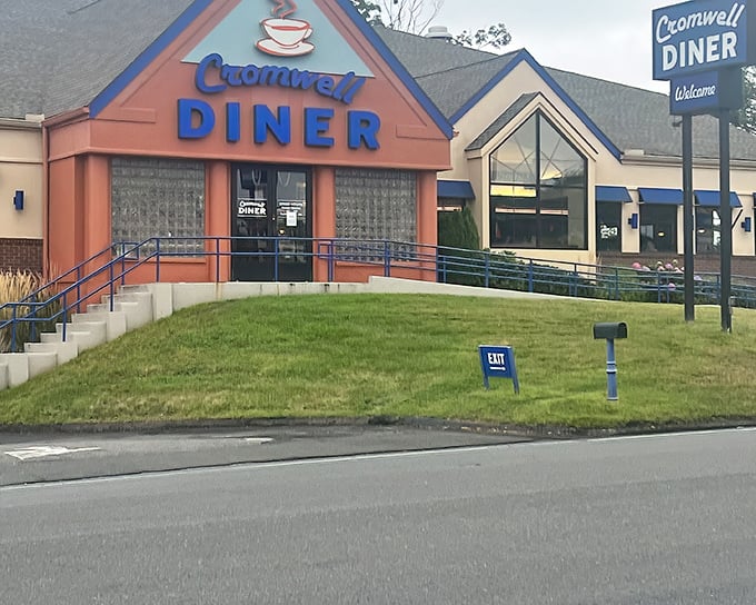 The iconic blue sign of Cromwell Diner stands like a beacon for hungry travelers, promising comfort food salvation just off Route 372. 