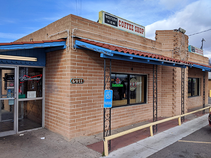 The neon-adorned vintage sign stands like a sentinel of comfort food, promising steaks, seafood, and the timeless appeal of a genuine coffee shop experience.