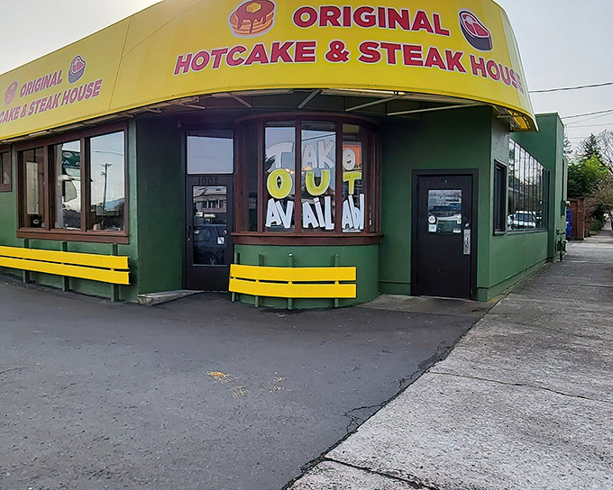 The unmistakable green and yellow exterior stands like a breakfast lighthouse on Powell Boulevard, beckoning hungry travelers at all hours.