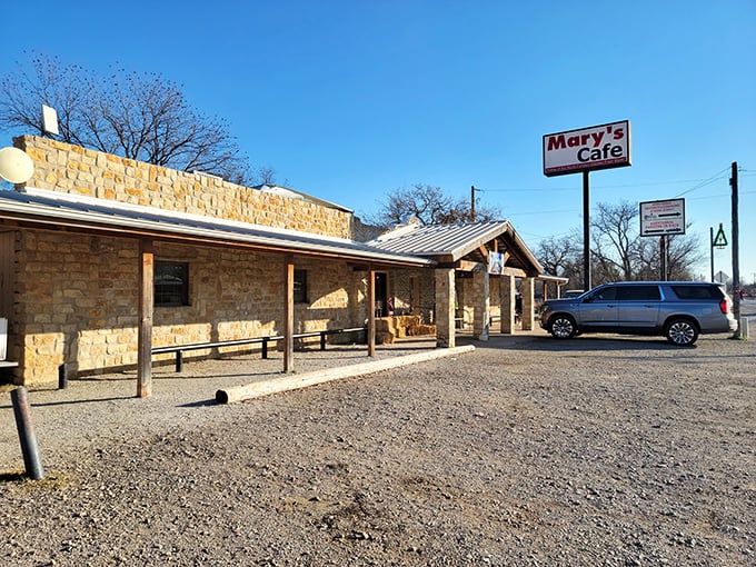 The unassuming exterior of Mary's Cafe stands proudly against the Texas sky &ndash; proof that culinary greatness often comes in humble packages.