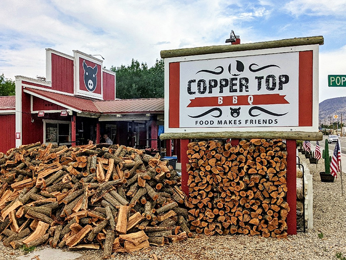 The iconic red barn-like exterior of Copper Top BBQ, where those massive smokers out front aren't just for show&mdash;they're the source of that heavenly aroma that hits you from a quarter-mile away.