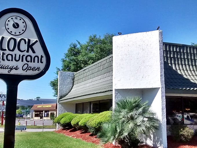 The unassuming exterior of Clock Restaurant in Gainesville hides a treasure trove of breakfast delights. Florida's palm trees stand guard outside this local institution.