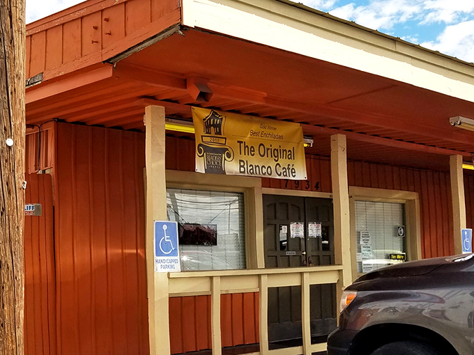 The unassuming orange exterior of Blanco Cafe stands like a humble guardian of culinary treasures. No fancy frills, just the promise of authentic Tex-Mex magic inside.