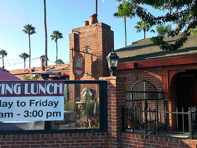 The brick exterior of Gulliver's stands like a time portal to old England, complete with wrought iron fencing and California sunshine playing peekaboo through the trees.