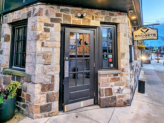 The unassuming stone exterior of Bridget's Steakhouse in Ambler hides culinary treasures within, like a delicious secret waiting to be discovered.