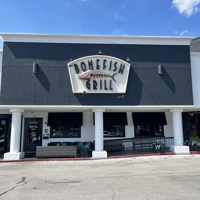 The iconic Bonefish Grill facade stands like a beacon for seafood lovers, its distinctive fish skeleton sign promising aquatic delights within.
