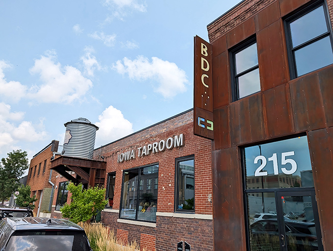 The iconic silo-shaped water tower proudly announces your arrival at The Iowa Taproom, where brick, bikes, and brews create the perfect Des Moines welcome.